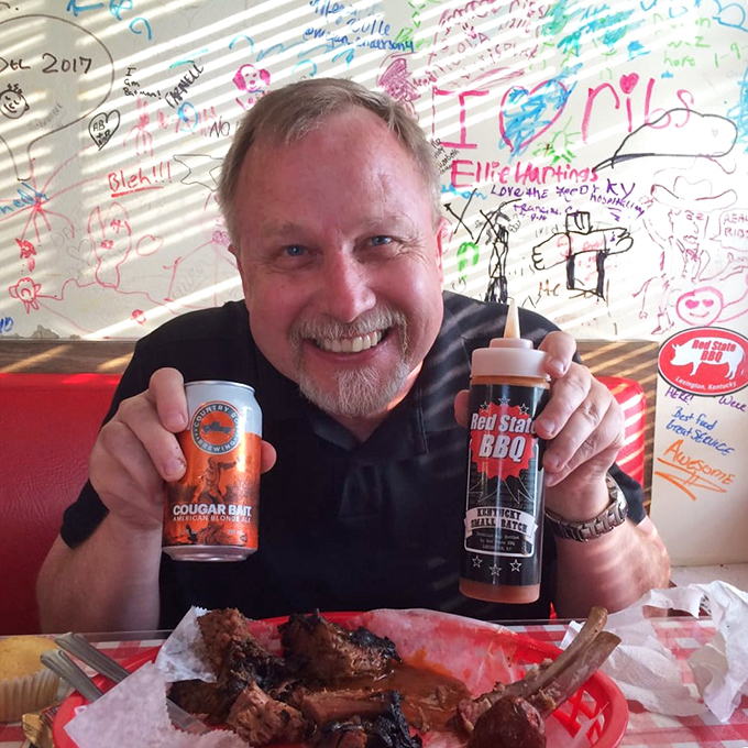 Say cheese! This happy diner's grin says it all &ndash; when the BBQ's this good, you can't help but smile. Even the sauce bottle looks like it's having a good time!