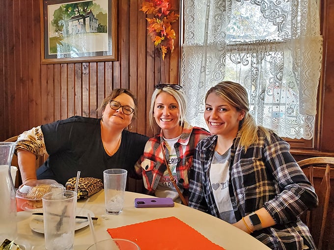 Happiness is best served family-style! These diners look ready to solve the world's problems over a slice of pie.