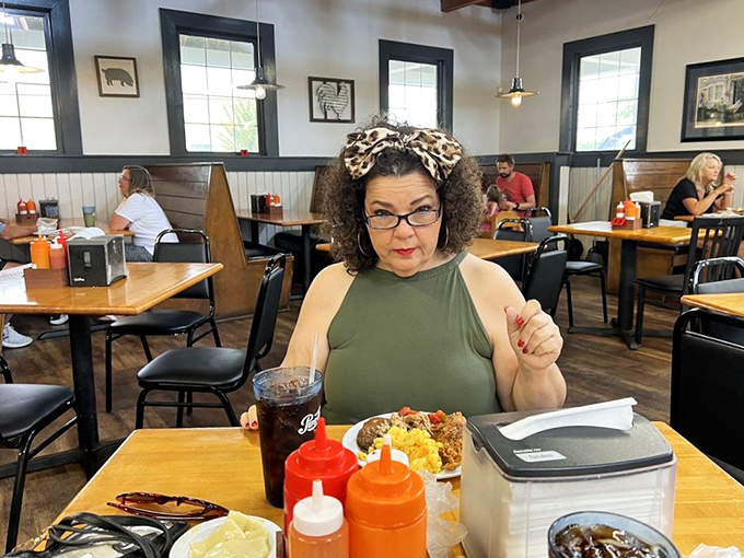 The dining room where strangers become friends, connected by the universal language of "mmm" and occasional synchronized napkin dabs.