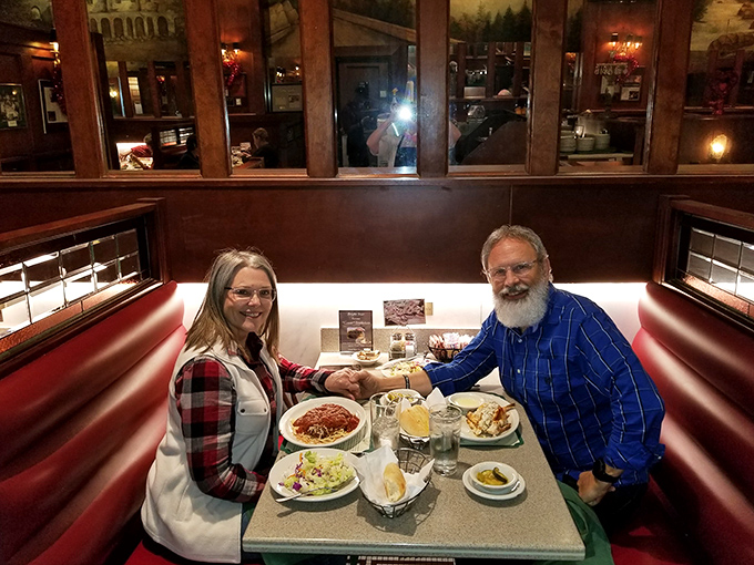 Happy diners, happy times! This cozy booth is where memories are made, one delicious bite at a time.