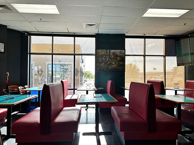 Red booths, blue tables, and a world of flavors. This dining area is where comfort meets adventure, one slice at a time.