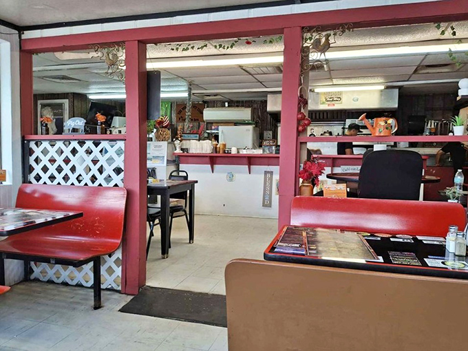 Red booths, checkered floors, and the promise of good eats. It's like stepping into a Norman Rockwell painting, but with better barbecue.