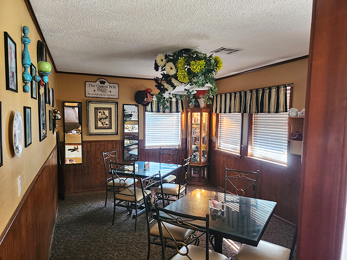 Cozy corner alert! Warm wood paneling, charming decor, and tables just waiting for good food and great conversations.