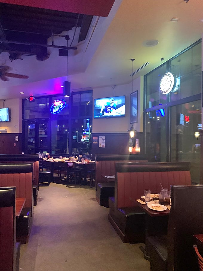 Cozy booths, mood lighting, and the gentle glow of TVs. It's like your living room, but with better food and no remote to fight over.