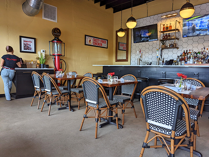 Bistro chairs, pendant lighting, and "Tasty Fried Chicken" signs&mdash;the dining room strikes that perfect balance between comfort and style.