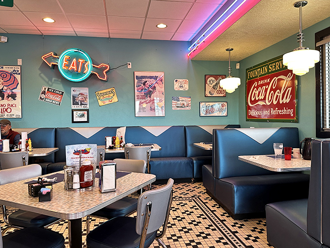 The dining area's turquoise walls and retro signs aren't manufactured nostalgia—they're living history in a space where countless Wyoming conversations have unfolded.