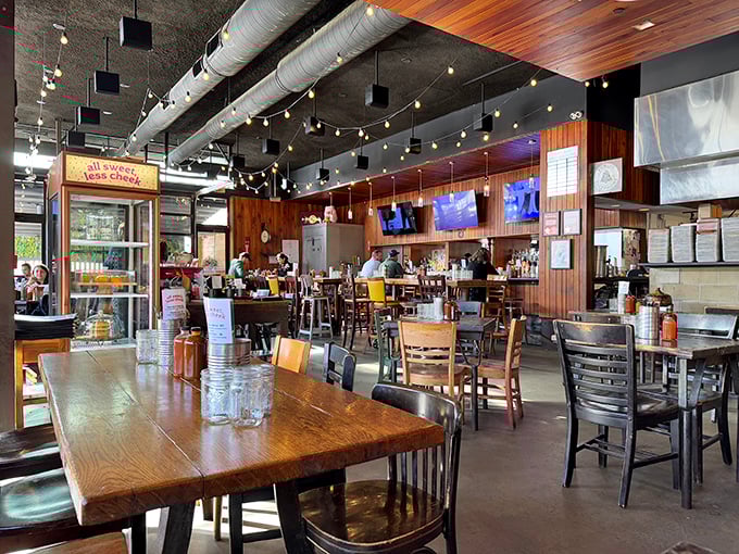 The warm wood paneling and industrial ceiling create that sweet spot between "Texas honky-tonk" and "Boston cool" where everyone feels instantly at home.