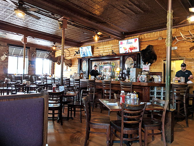 The dining area balances rustic charm with practical comfort, where the only thing more inviting than the decor is the aroma.