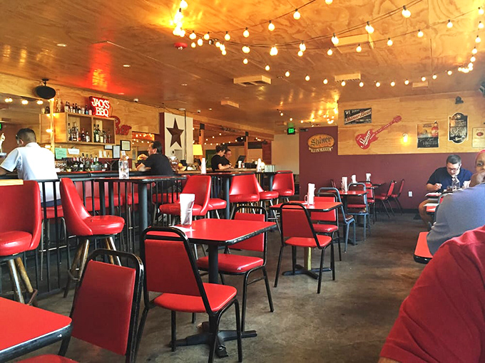 Red chairs and wooden tables create the perfect stage for the real stars of the show: the smoked meats.