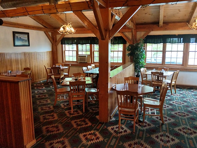 This dining area is like a lumberjack's living room &ndash; if that lumberjack had impeccable taste in rustic chic. The wooden beams and cozy lighting create an atmosphere that's pure Vermont charm.