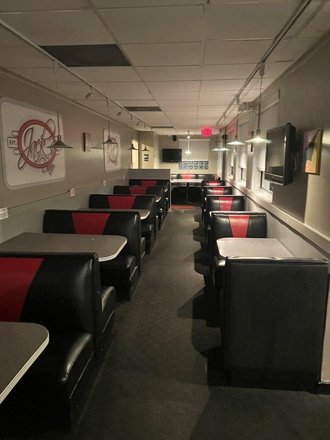 Red and black booths line up like loyal soldiers, ready for the daily breakfast battle. This dining area is primed for pancake domination.