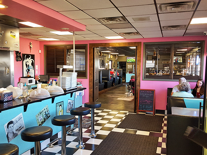 Pink walls, blue counters, and enough nostalgia to fill a jukebox. This dining area is like a warm hug from your favorite decade.