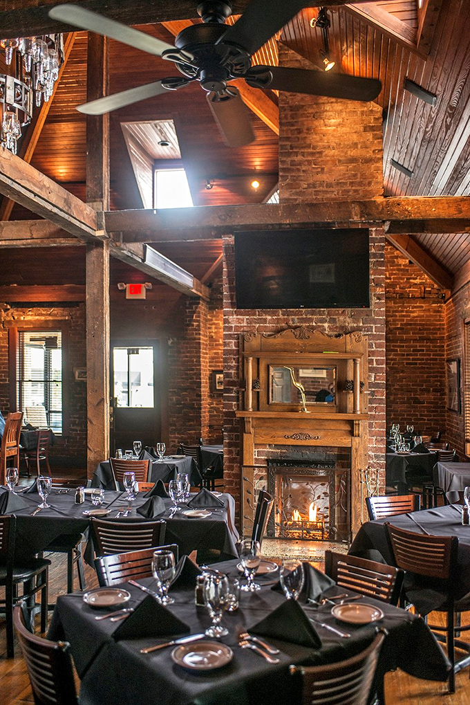 Exposed brick, wooden beams, and a fireplace that could warm even the coldest of hearts. It's like dining in a Norman Rockwell painting, but with better lighting.