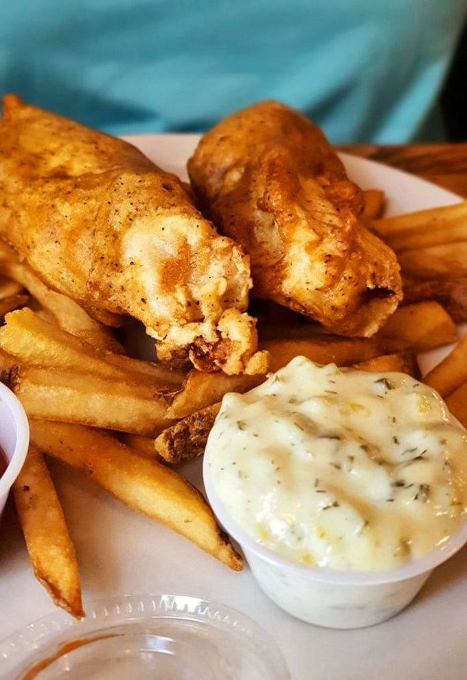 Fish so perfectly battered it practically auditions for the Royal Shakespeare Company, with chips that crunch like autumn leaves.