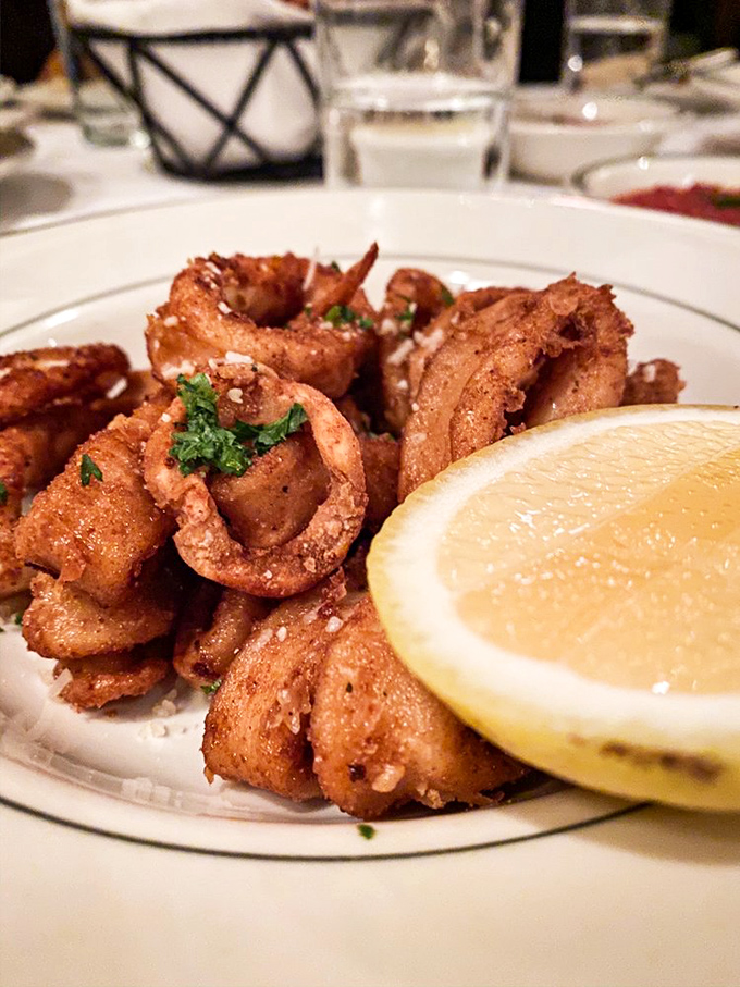 Crispy calamari: the gateway appetizer that separates casual diners from those who understand that true luxury begins with perfect frying technique.