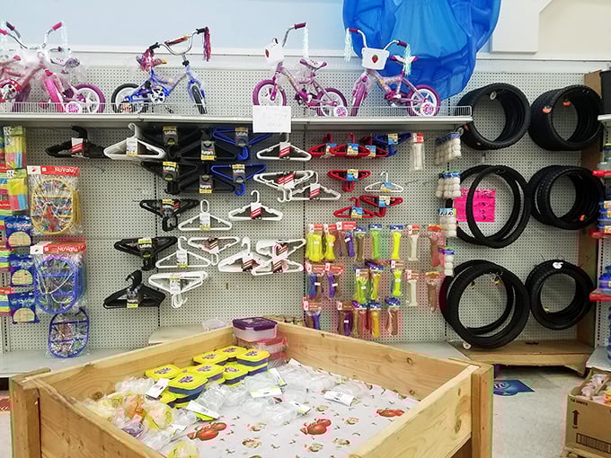 Tiny bicycles and household essentials share shelf space in this wonderland of random treasures—childhood joy meets practical living.