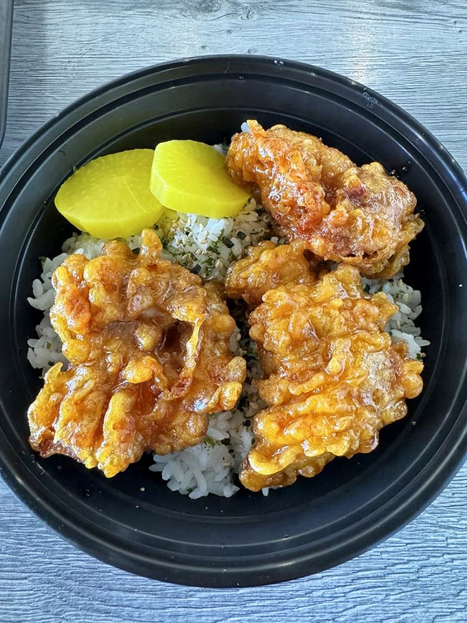 Rice bowls reimagined! Golden chicken perched atop rice with that signature yellow pickled radish &ndash; a harmony of flavors that sings like The Temptations.