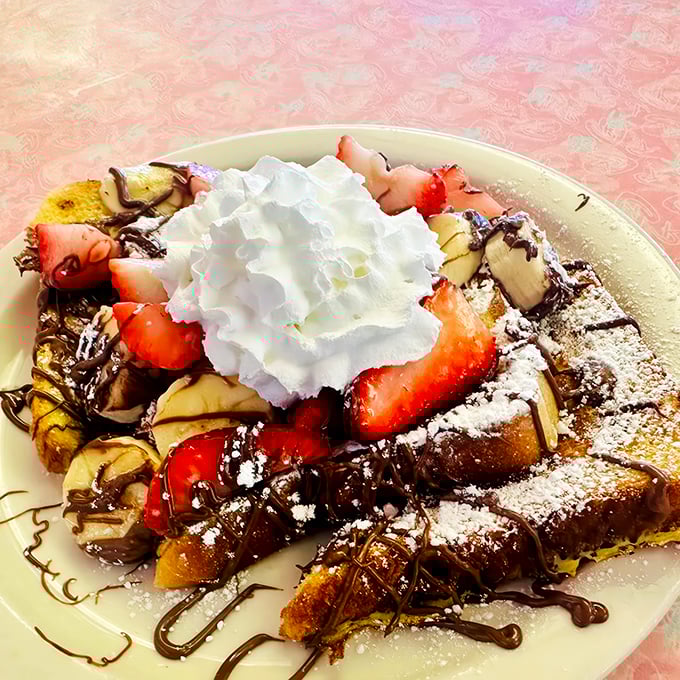 French toast fantasy! This Nutella-drizzled creation is so decadent, it should come with a warning label: "May induce spontaneous happy dances."