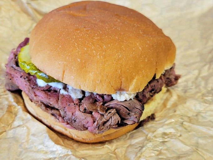 Behold, the star of the show! This pit beef sandwich is so packed, it's like a meaty hug between two buns.