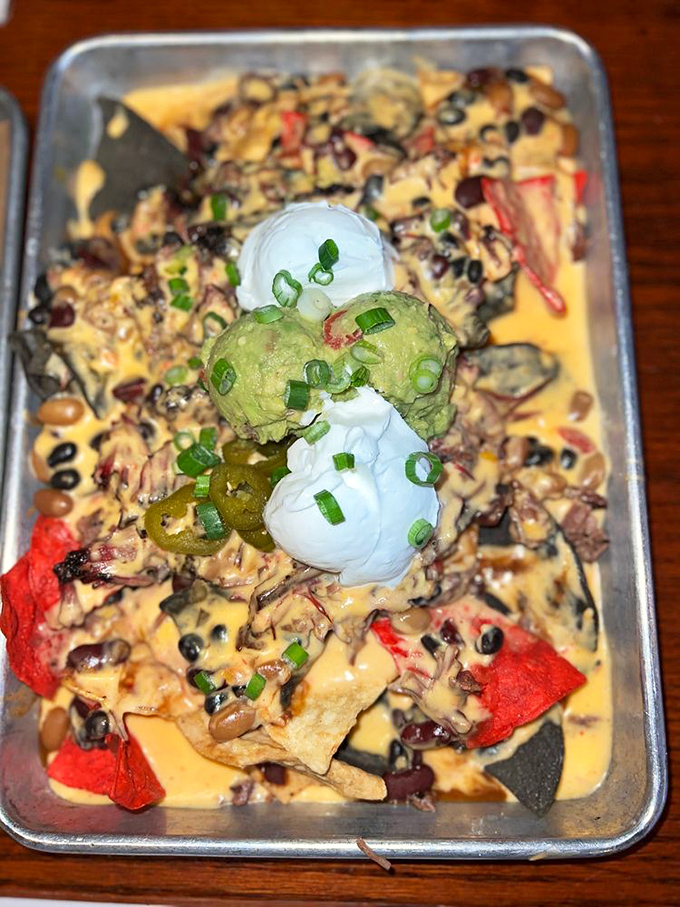 Nacho average appetizer! These pulled pork nachos are a fiesta on a plate, complete with all the fixings.