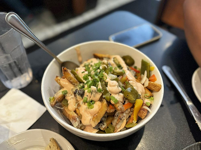 Schlubby Fries aren't trying to impress anyone, but they do anyway. Topped with pastrami, Russian dressing, and pickled peppers&mdash;fries living their best life.