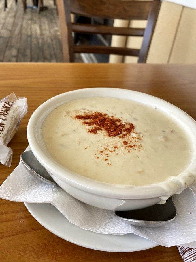 A bowl of seafood soup so comforting, it's like a warm hug from your favorite pescatarian grandmother.