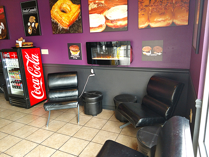 Purple walls and donut art? This seating area is like the cool aunt's house &ndash; funky, fun, and always stocked with treats.
