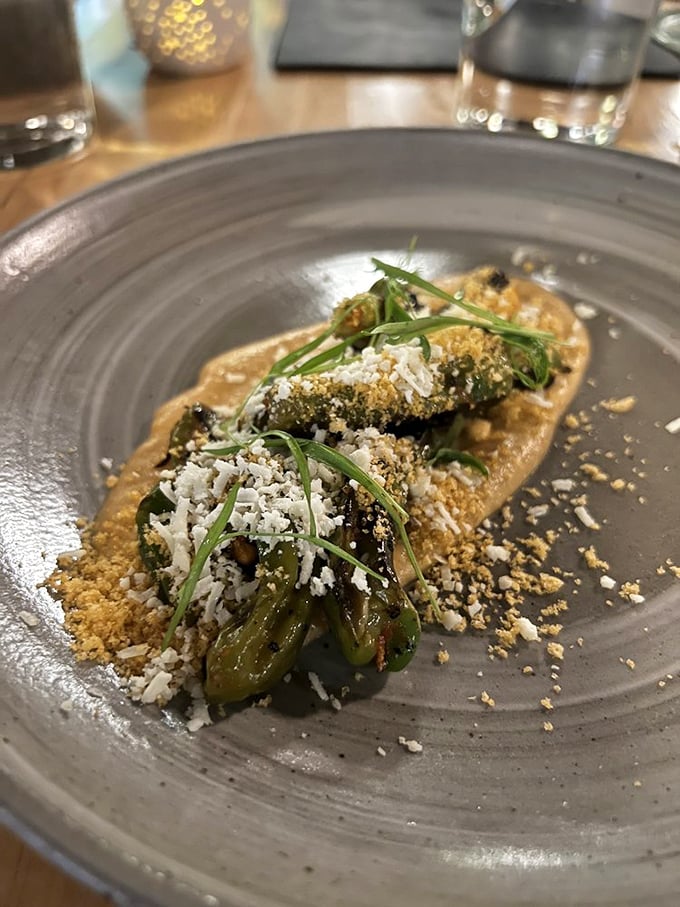 Blistered shishitos lounging in sauce remind us that sometimes the best vegetables are the ones that play with a little fire.