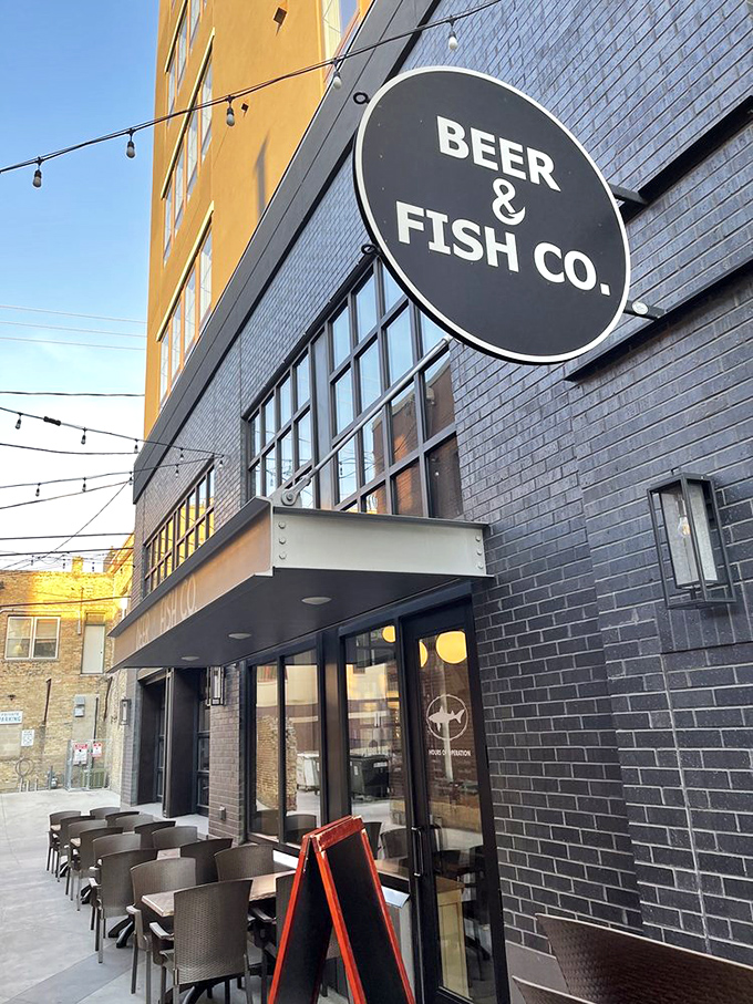 The Bat-Signal for seafood lovers! This sign is like a lighthouse guiding hungry sailors to a port of deliciousness.