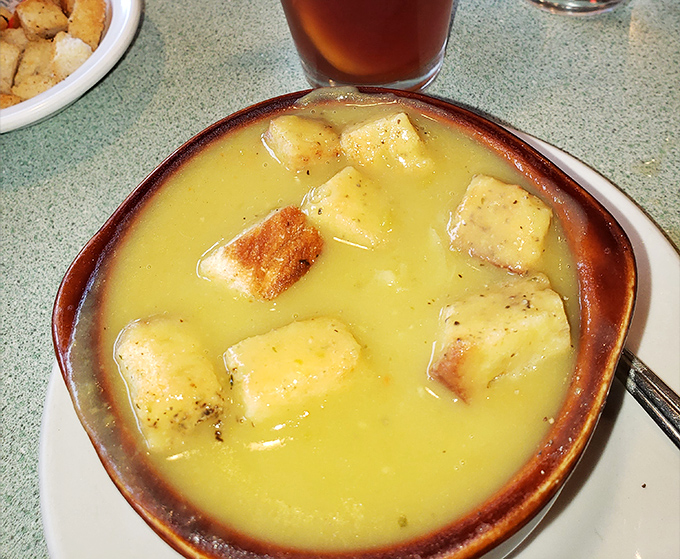 Split pea soup so golden, it could be mistaken for liquid sunshine. Comfort in a bowl, no spoon-bending required.