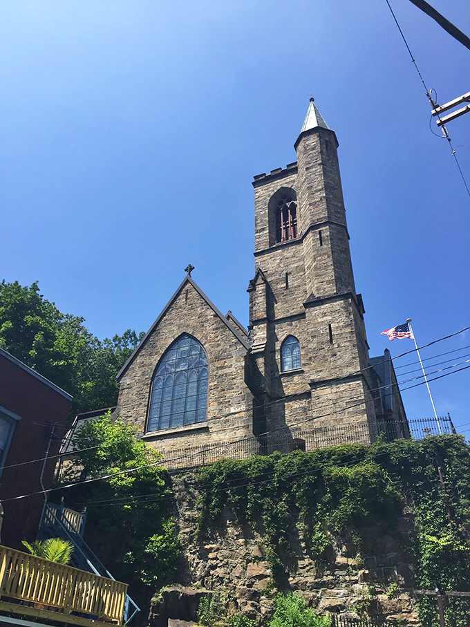St. Mark's & St. John's Episcopal Church reaches skyward like a stone prayer, its tower a spiritual exclamation point against Pennsylvania's blue canvas.