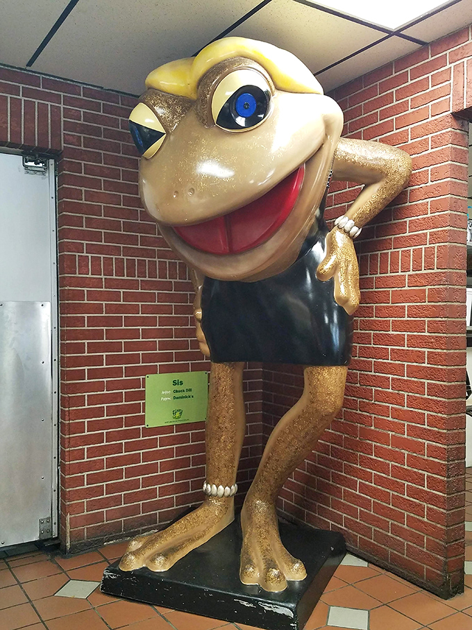 Meet the diner's unofficial greeter: a statue with more personality than some politicians. He's got a smile that says, "Come on in, the calories are fine!"