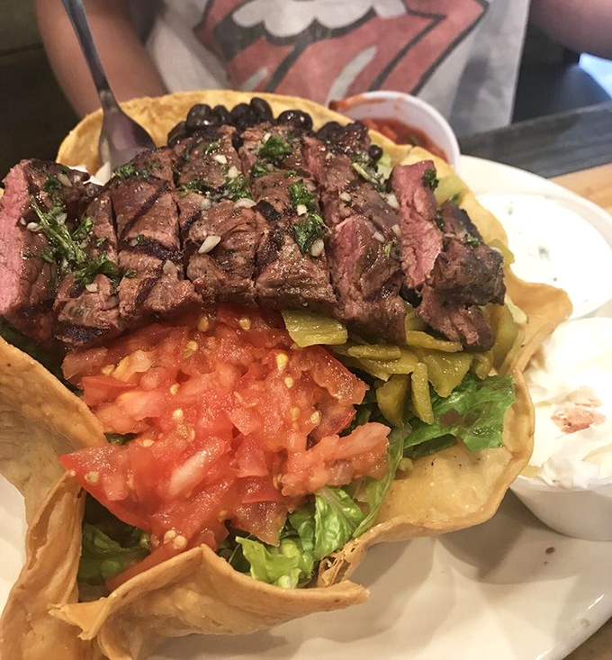 A steak taco salad that laughs in the face of diet plans. Who knew being bad could taste so good?
