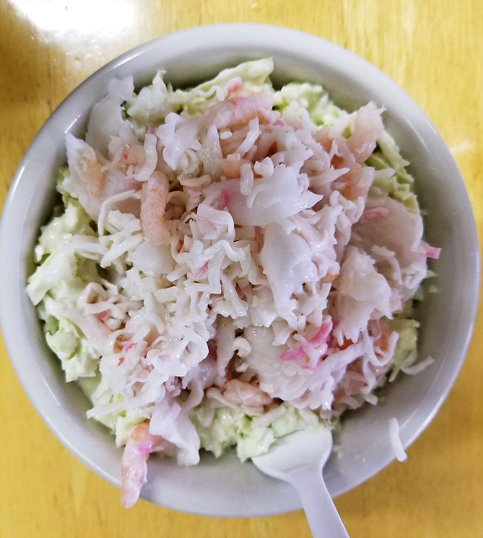 A salad that's more than just roughage! This surimi creation proves that sometimes, the best catch doesn't require a fishing rod.
