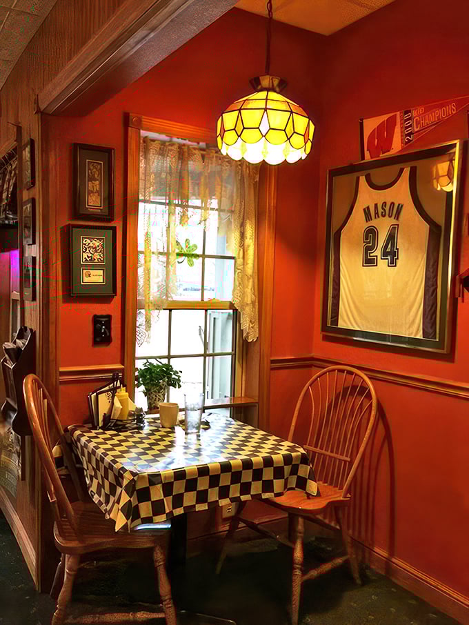 Checkmate, fancy restaurants! This cozy nook at Solly's proves that sometimes, the best dining rooms come with a side of sports memorabilia and homey charm.