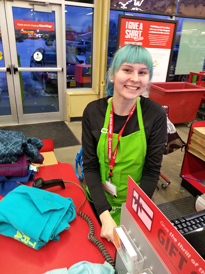 The friendly face of thrift store magic. This cheerful employee is ready to help you navigate the sea of secondhand wonders.