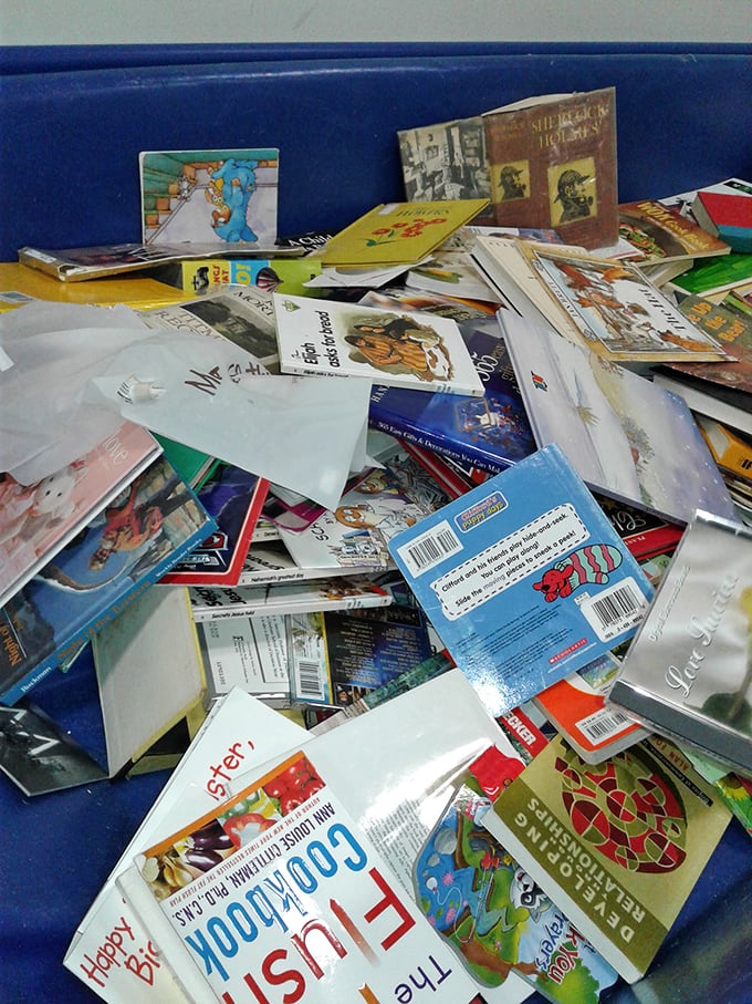 Literary treasures stacked like pancakes, waiting to be discovered. That cookbook might contain someone's grandmother's handwritten notes in the margins.