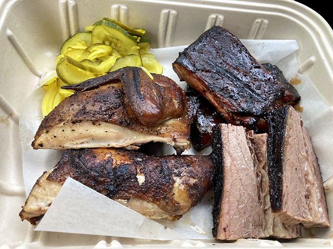 A meat lover's fantasy league draft pick &ndash; brisket, ribs, and chicken playing for Team Delicious, with pickles as the MVP sidekick.