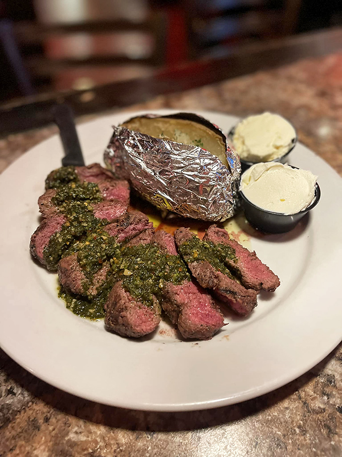 Flat iron steak with a side of "where have you been all my life?" That green sauce is like a bear hug for your taste buds.