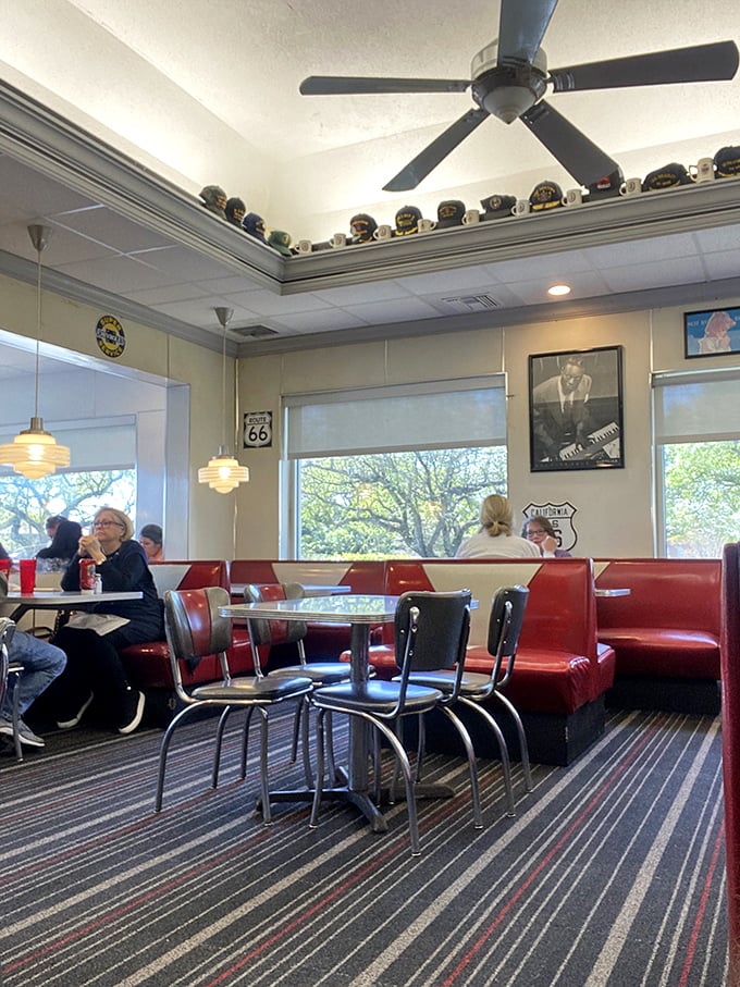 Retro heaven! With classic car memorabilia and cozy booths, this diner interior is serving up ambiance with a side of nostalgia.