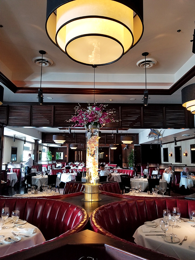 A dining room that's part swanky supper club, part seafood sanctuary. Those red booths are calling your name louder than a dinner bell.