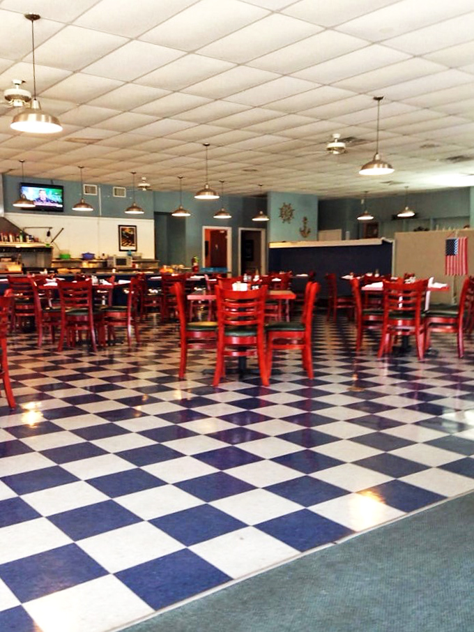 Welcome to the land of red chairs and checkered floors. It's like a 1950s diner got a modern makeover, but kept all the charm.