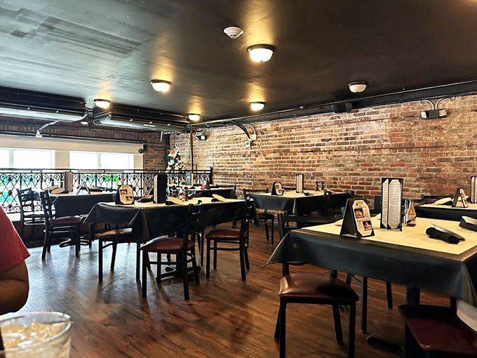 Dine like a sea captain in this charming space! With exposed brick and warm wood, it's like a hug from a really stylish lighthouse.