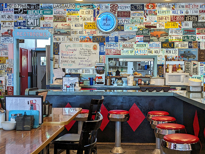 License plate heaven! This wall isn't just decor; it's a road trip through America's heartland, one vintage plate at a time. Talk about plate expectations!