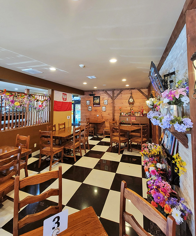 The dining room feels like the cabin your wealthy friend's parents own in the mountains. Polish flags and flowers add touches of homeland pride.
