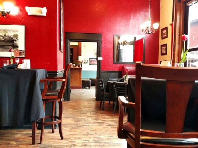 Red walls, wooden floors, and the promise of delicious food. It's like walking into your coolest friend's living room... if they were a master chef.