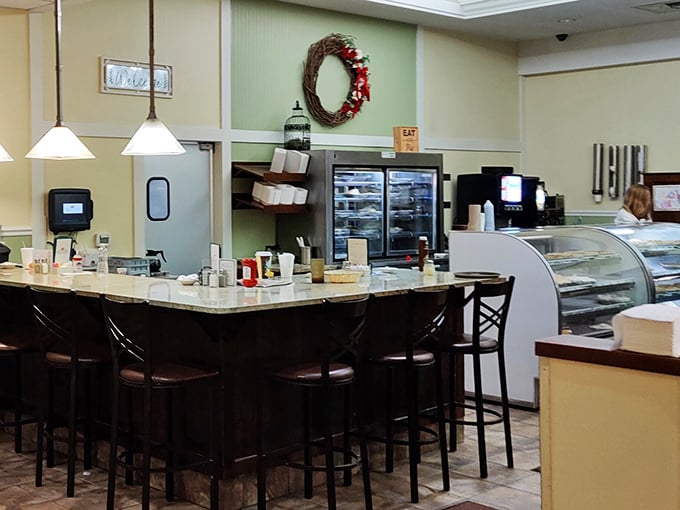 Welcome to the heart of Bingham's! This bustling counter is where pie dreams come true and coffee cups runneth over. It's like Cheers, but with better desserts.