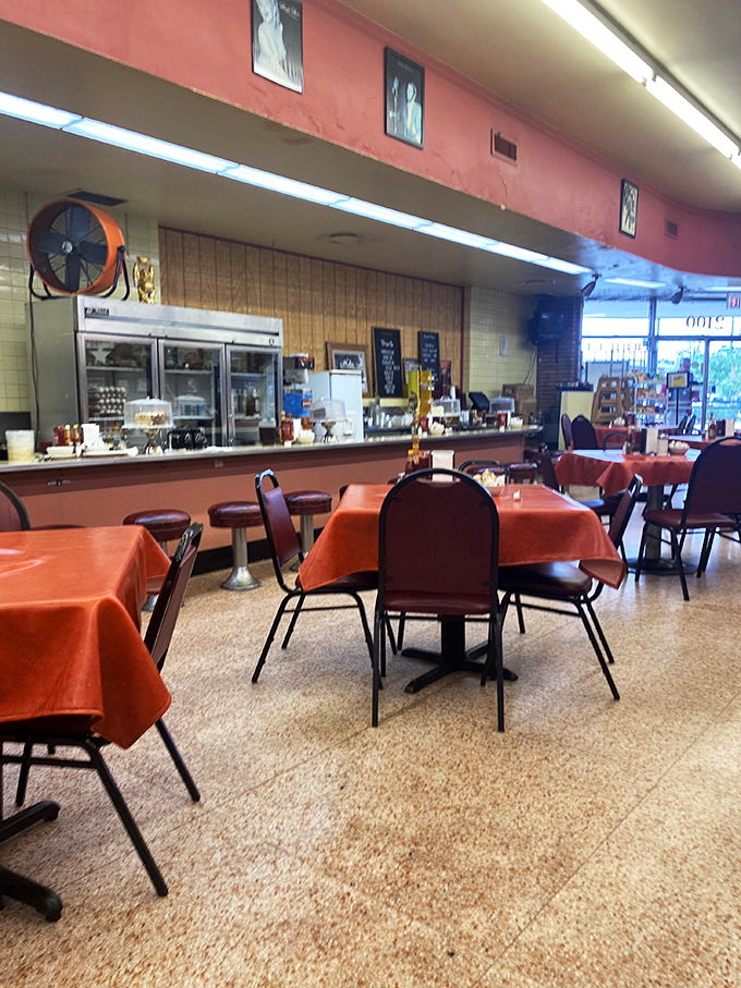 Retro chic meets cozy comfort! With its warm lighting and eclectic decor, this space feels like your cool grandma's living room &ndash; if she served amazing milkshakes.