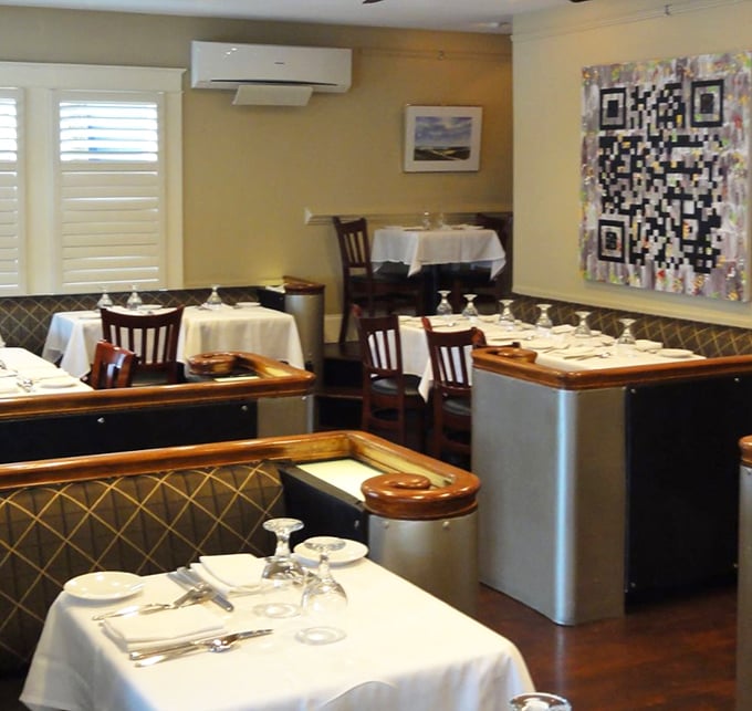 Intimate corners and crisp white tablecloths set the stage for culinary magic. Blue Moon's interior is where comfort meets sophistication.