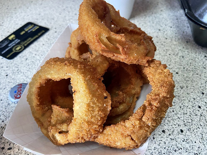 Onion rings so perfectly golden and crispy, they deserve their own championship belt.